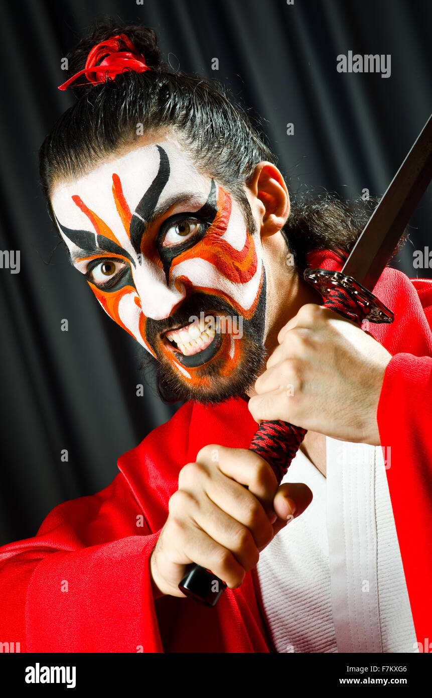 Man with sword and face mask Stock Photo - Alamy