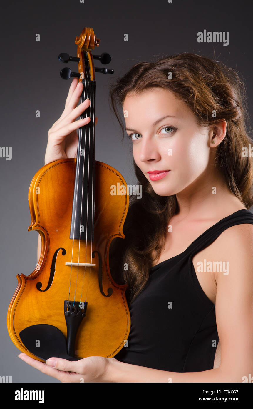 Woman artist with violin in music concept Stock Photo - Alamy