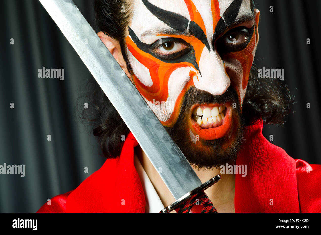 Man with sword and face mask Stock Photo - Alamy