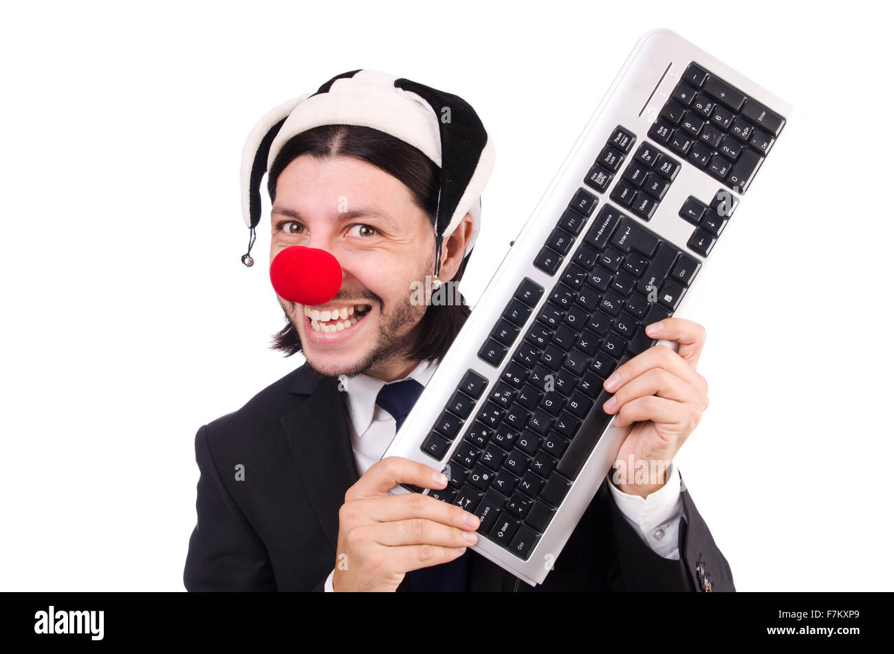 Funny clown with keyboard isolated on white Stock Photo - Alamy