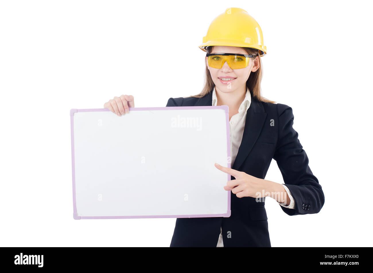 Pretty businesswoman with hard hat and blank board isolated on white ...