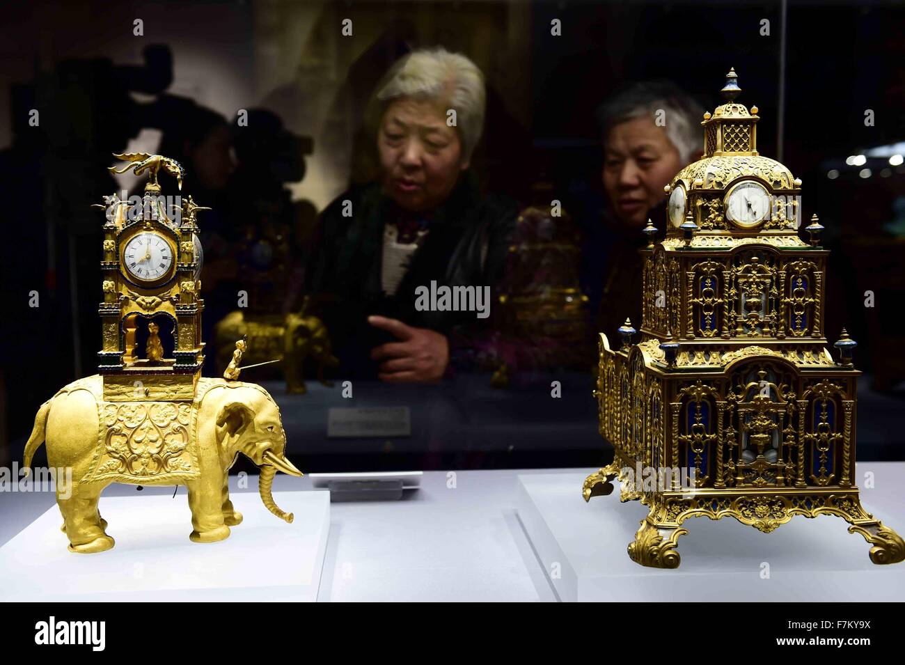 Jinan, China's Shandong Province. 1st Dec, 2015. Visitors view clocks ...