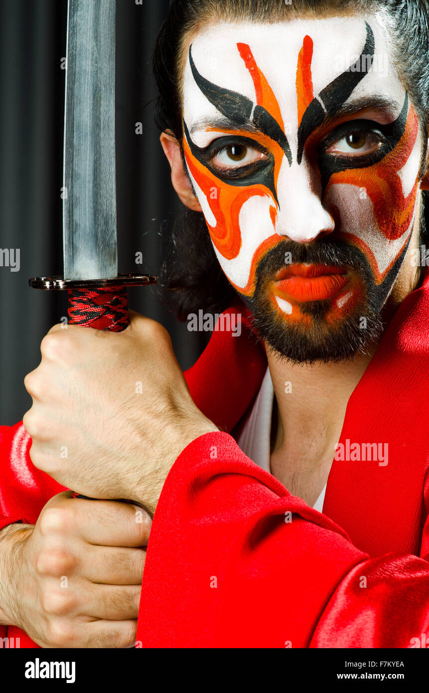 Man with sword and face mask Stock Photo - Alamy