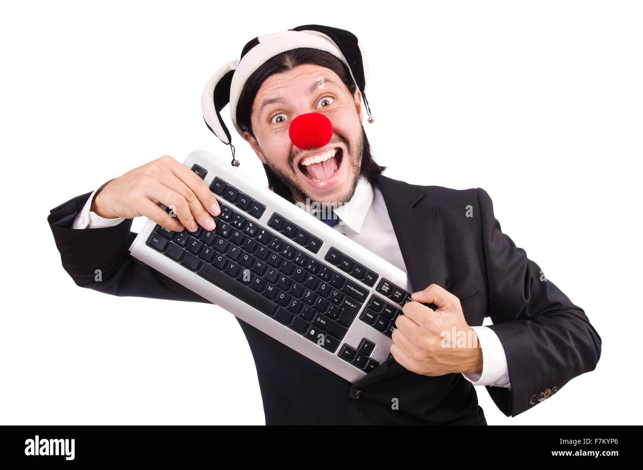 Funny clown with keyboard isolated on white Stock Photo - Alamy