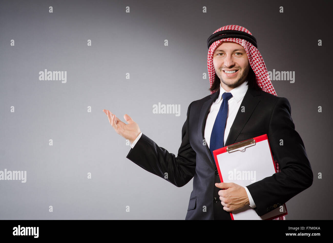 Arab man with paper binder Stock Photo - Alamy