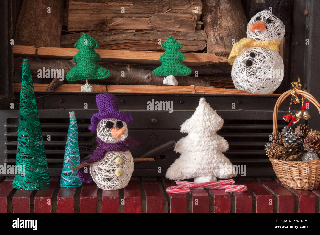 a horizontal frontal view of a decorated fireplace with some Christmas ...