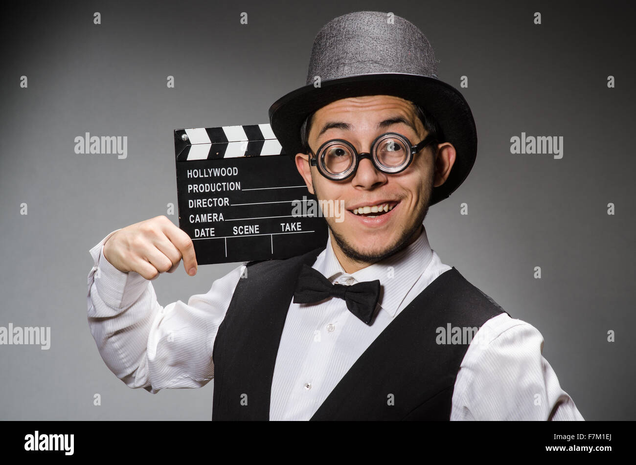 Funny man with movie clapper Stock Photo - Alamy
