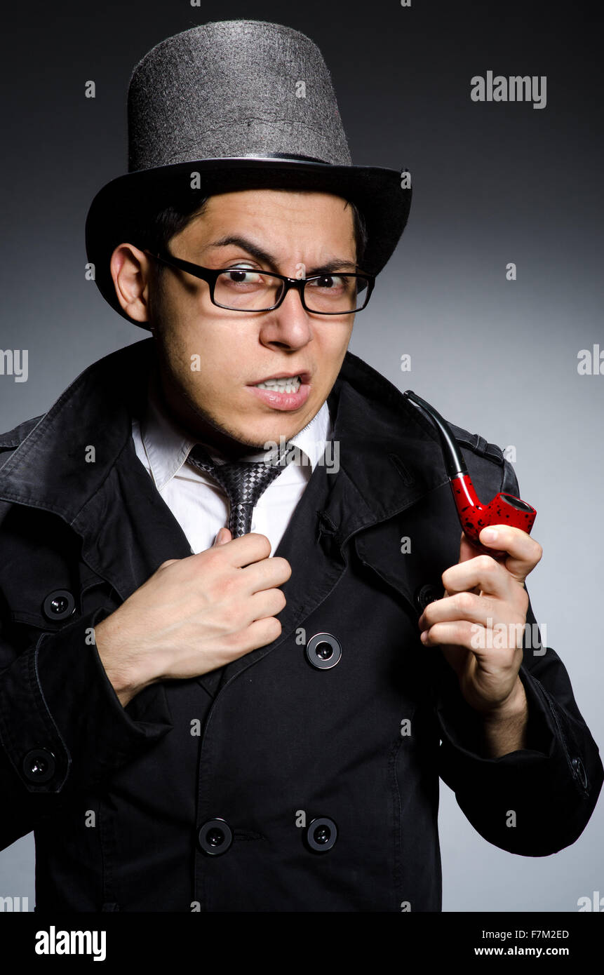 Funny detective with pipe and hat Stock Photo - Alamy