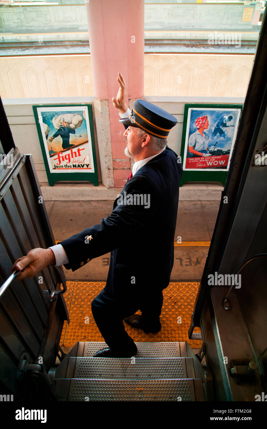 Conductor says "All Aboard" on Pearl Harbor Day Troop train reenactment ...