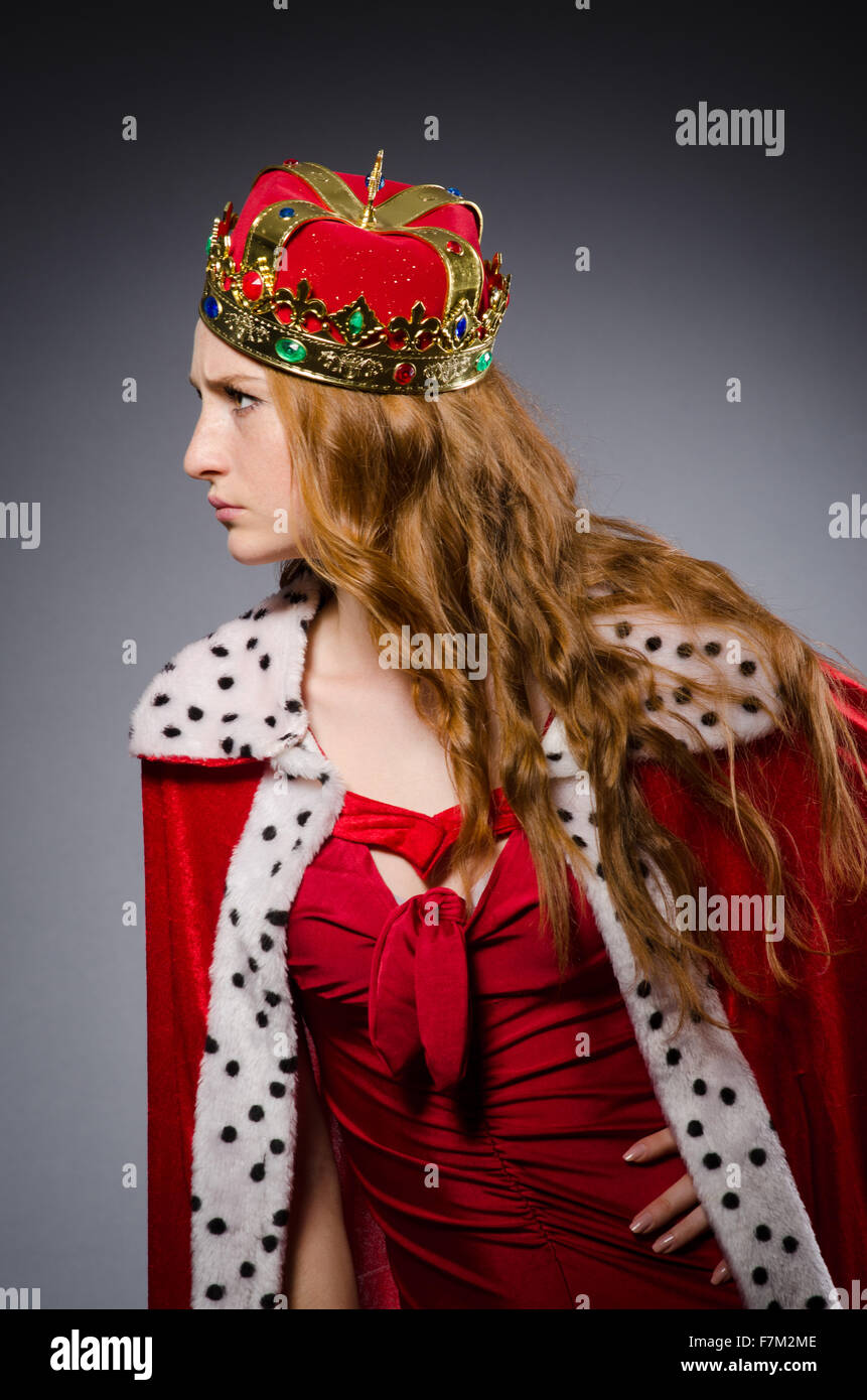 Queen in red dress in studio Stock Photo - Alamy