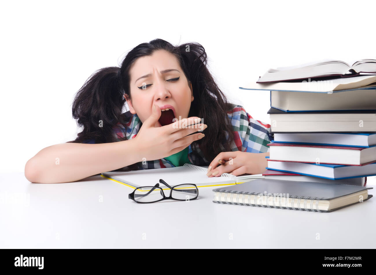 Tired student with textbooks on white Stock Photo - Alamy