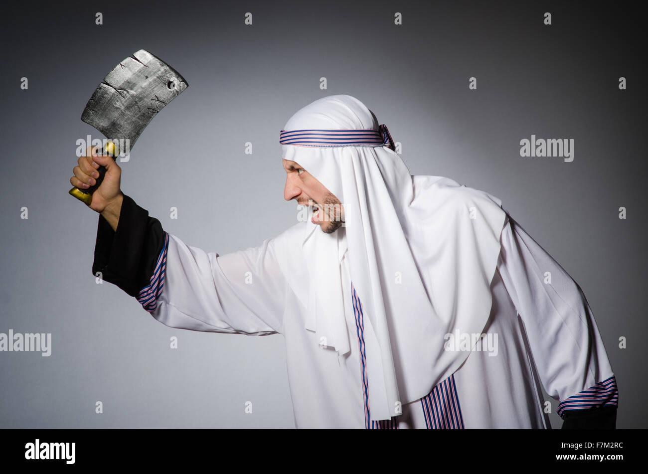 Arab man with sharp axe Stock Photo - Alamy