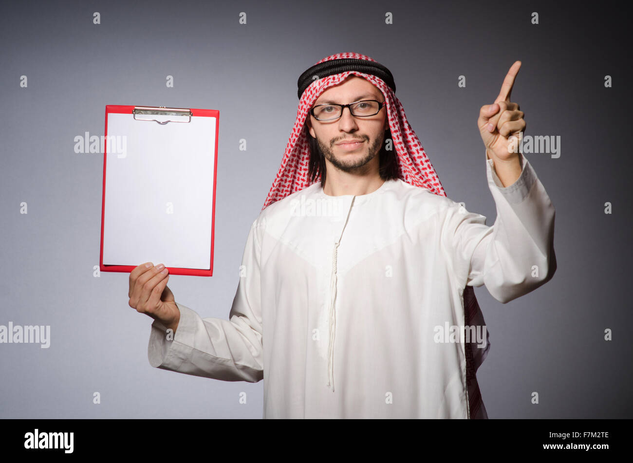 Arab man with paper binder Stock Photo - Alamy