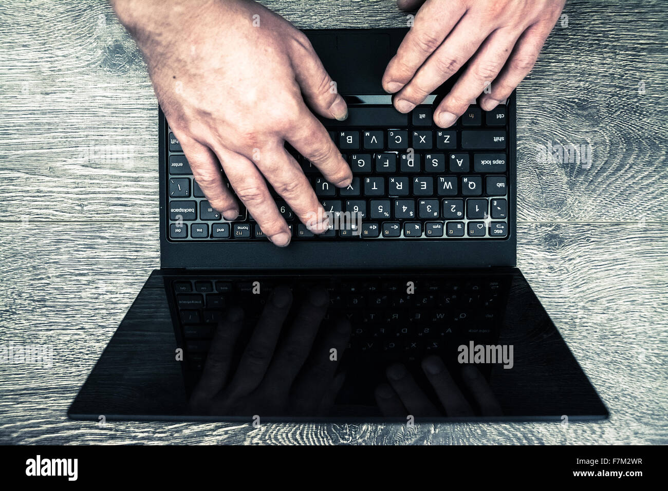 laptop with hands on wood Stock Photo - Alamy