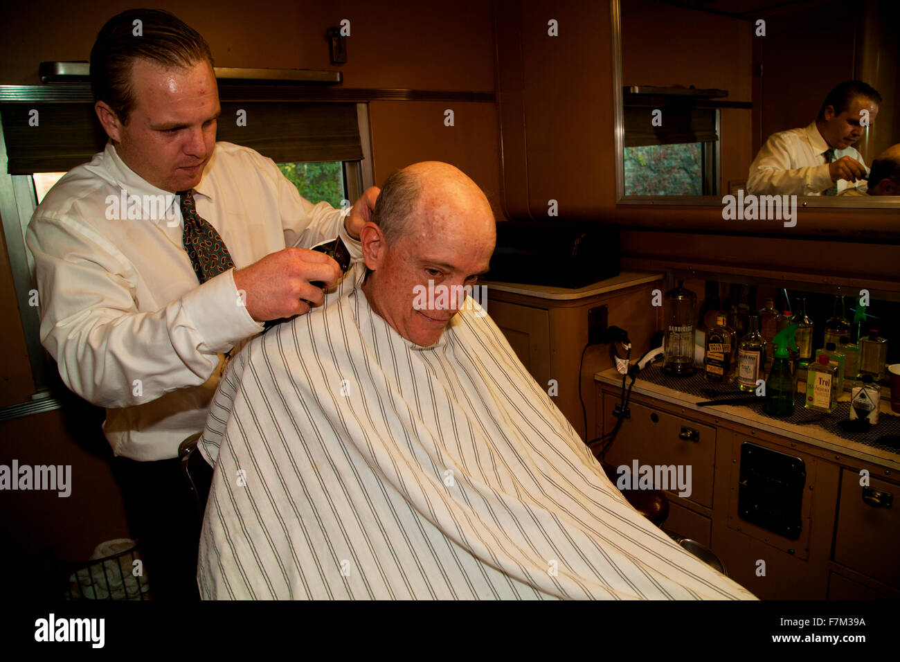 Photographer Joseph Sohm gets haircut in barbershop of Pearl Harbor Day ...