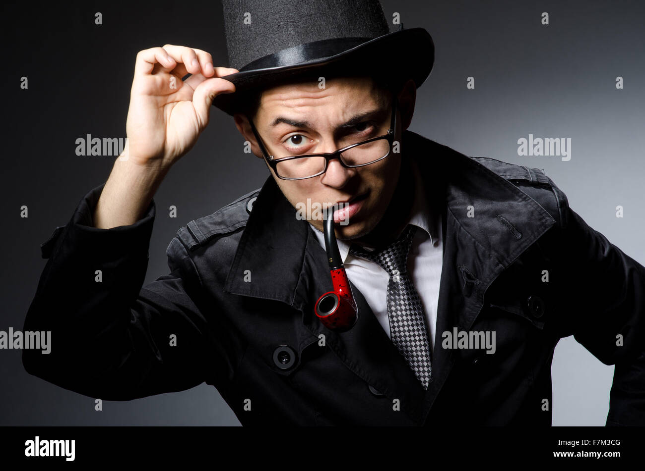 Funny detective with pipe and hat Stock Photo - Alamy