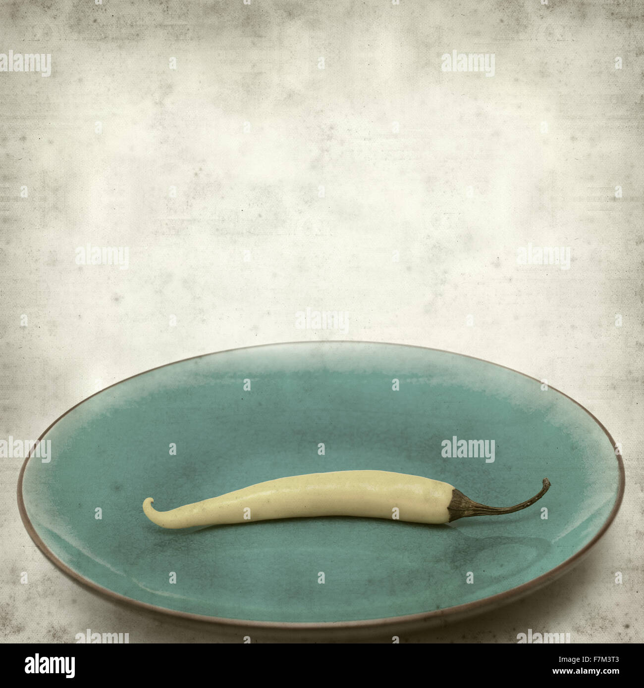 textured old paper background with yellow chilli pepper Stock Photo - Alamy