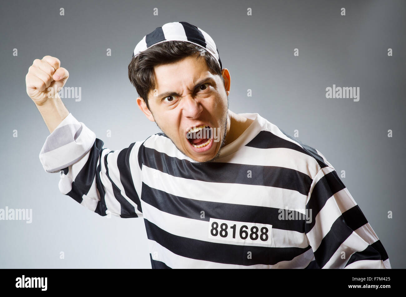 Funny prison inmate in concept Stock Photo - Alamy