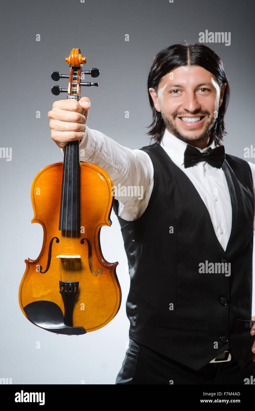 Funny fiddle violin player in musical concept Stock Photo - Alamy