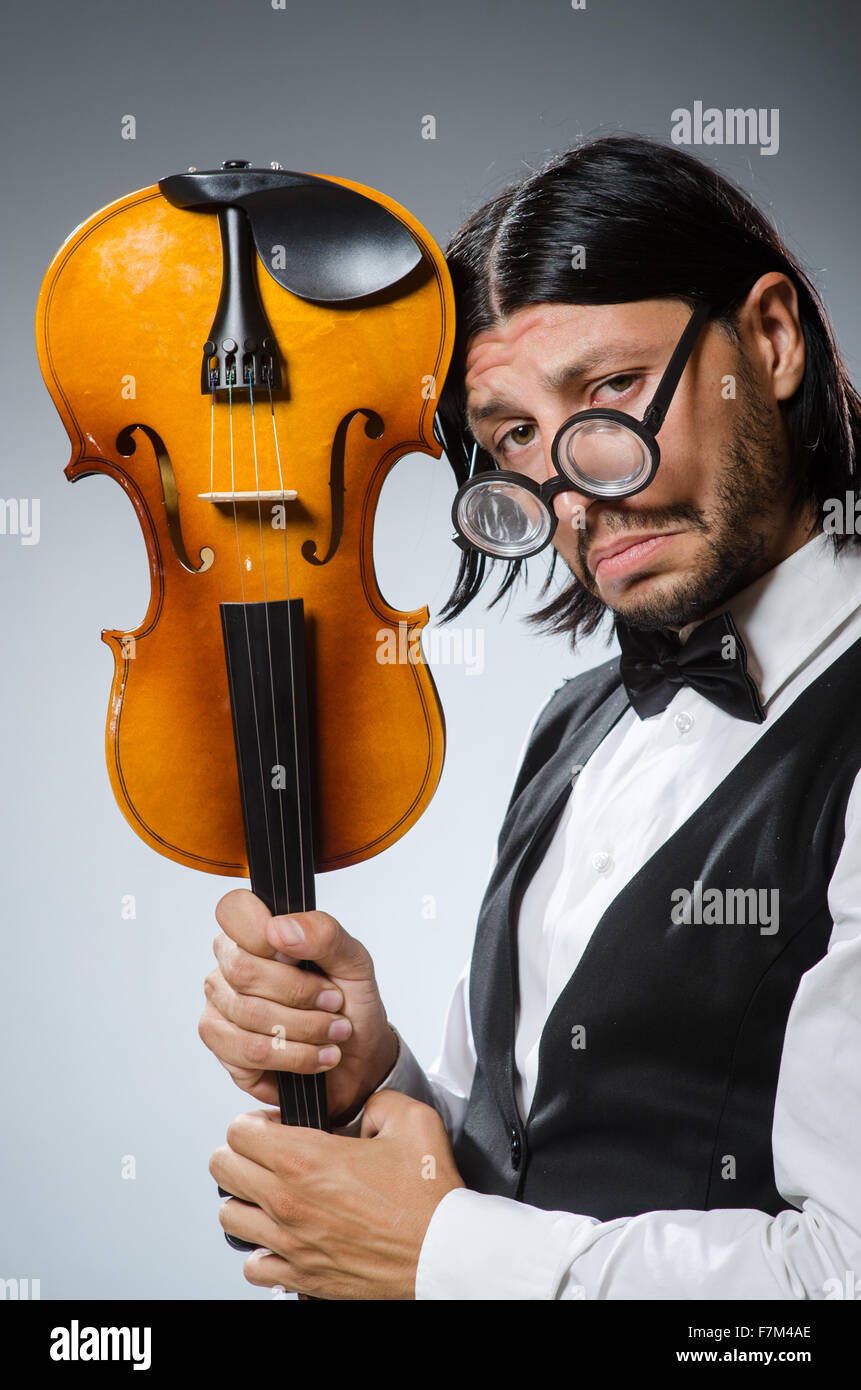 Funny fiddle violin player in musical concept Stock Photo - Alamy