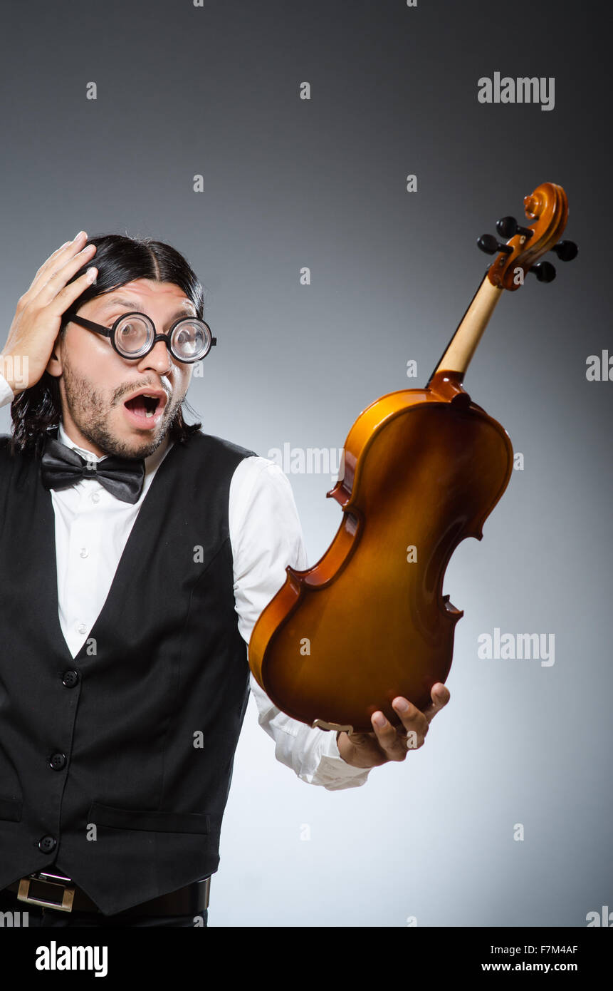 Funny fiddle violin player in musical concept Stock Photo - Alamy