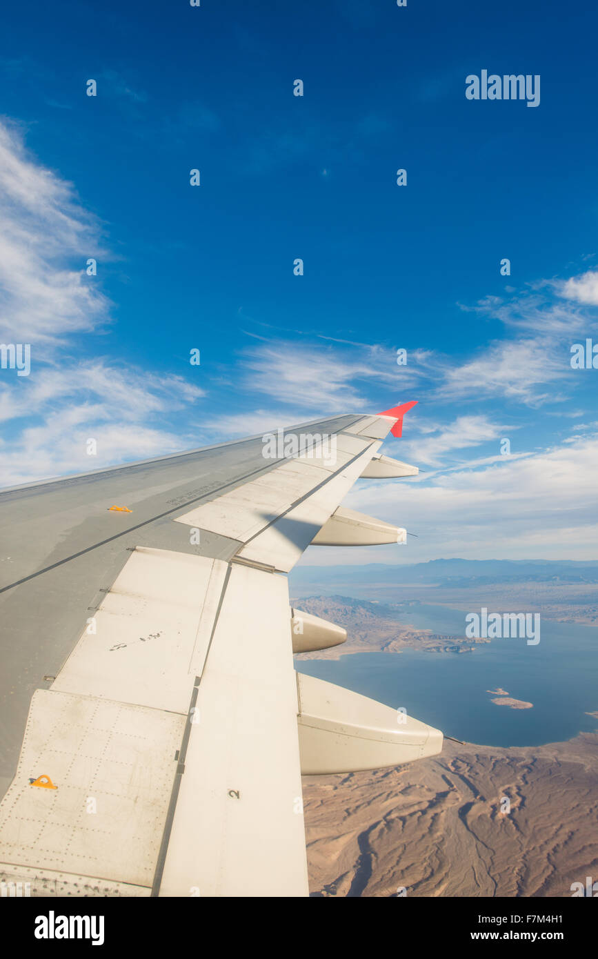 Airplane wing out of window Stock Photo - Alamy