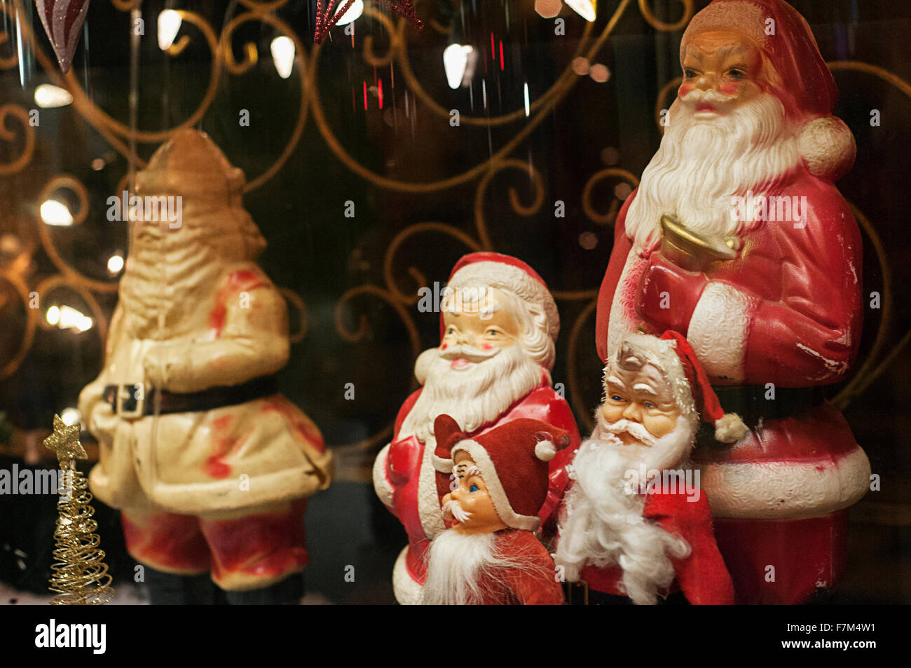 A window display of old fashioned Santas in New York Stock Photo - Alamy