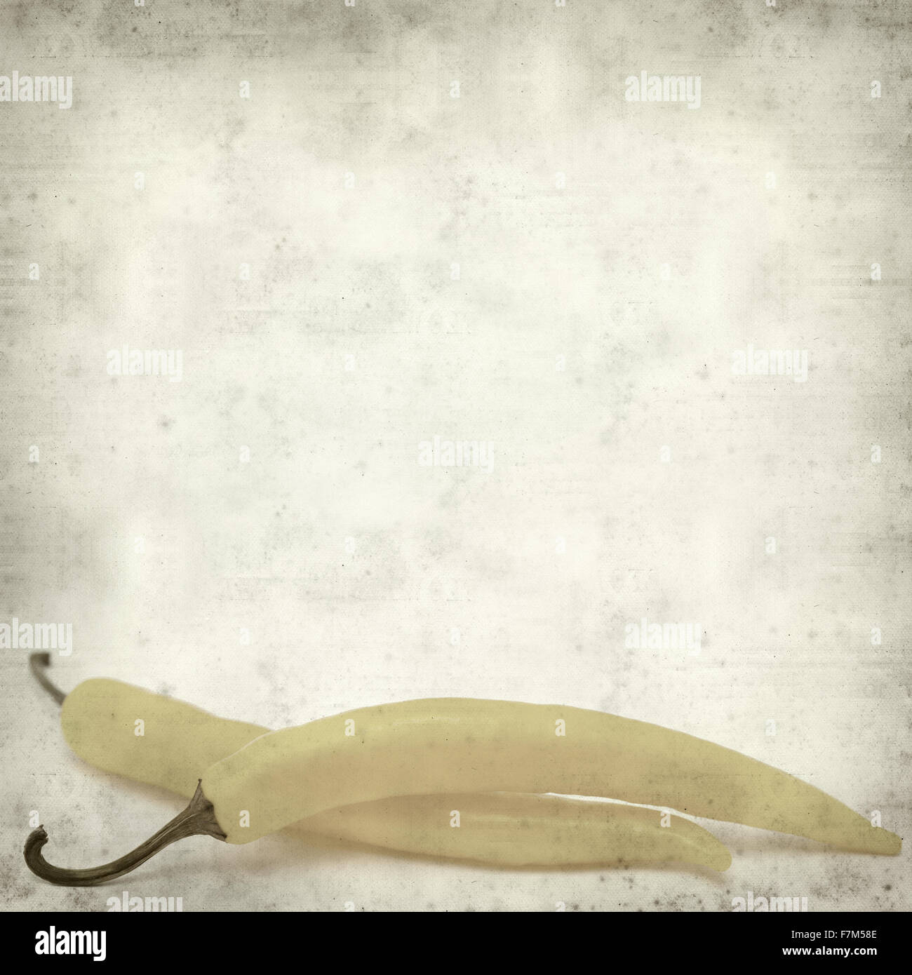 textured old paper background with yellow chilli pepper Stock Photo - Alamy
