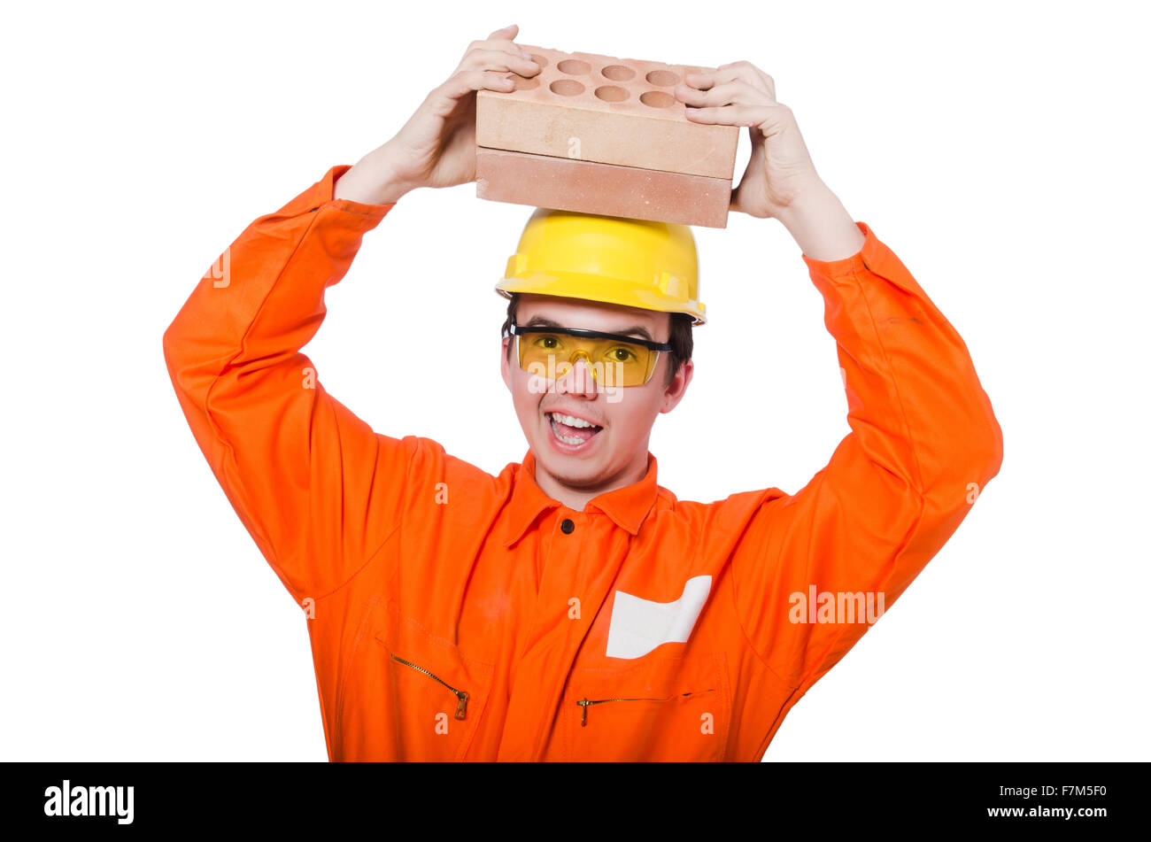 Man with brick isolated on white Stock Photo - Alamy