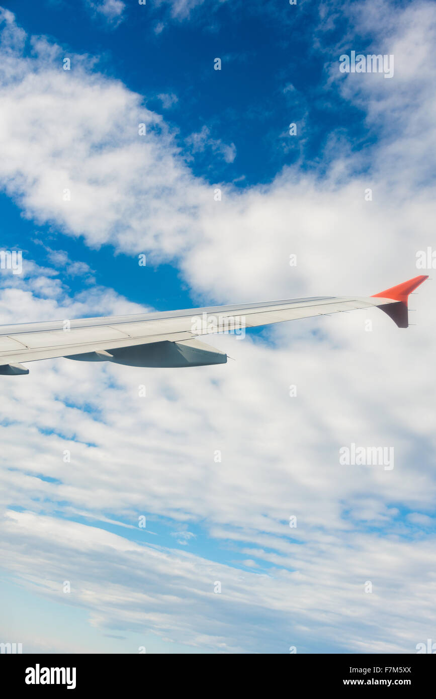 Airplane wing out of window Stock Photo - Alamy