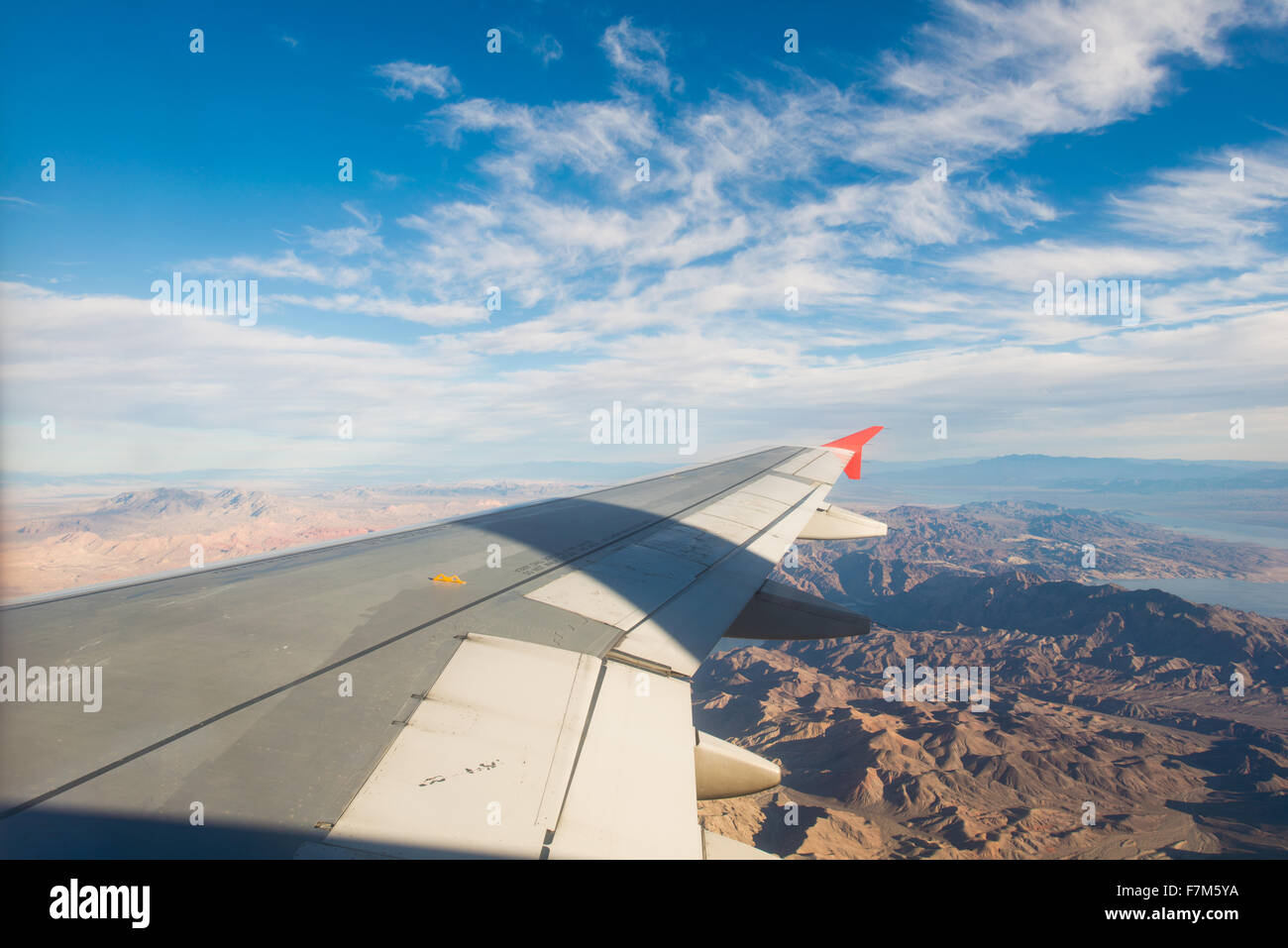 Airplane wing out of window Stock Photo - Alamy