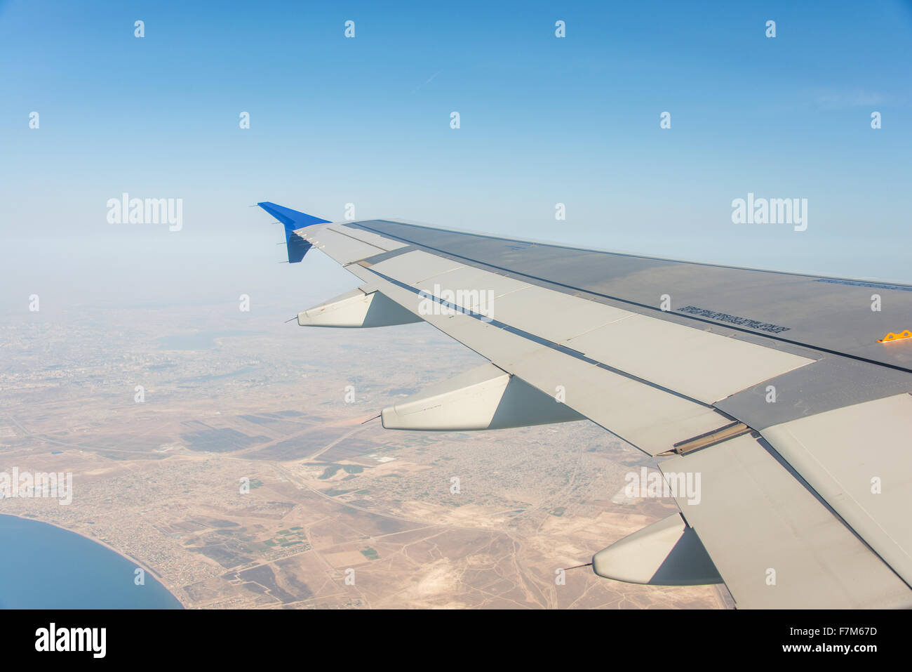Airplane wing out of window Stock Photo - Alamy