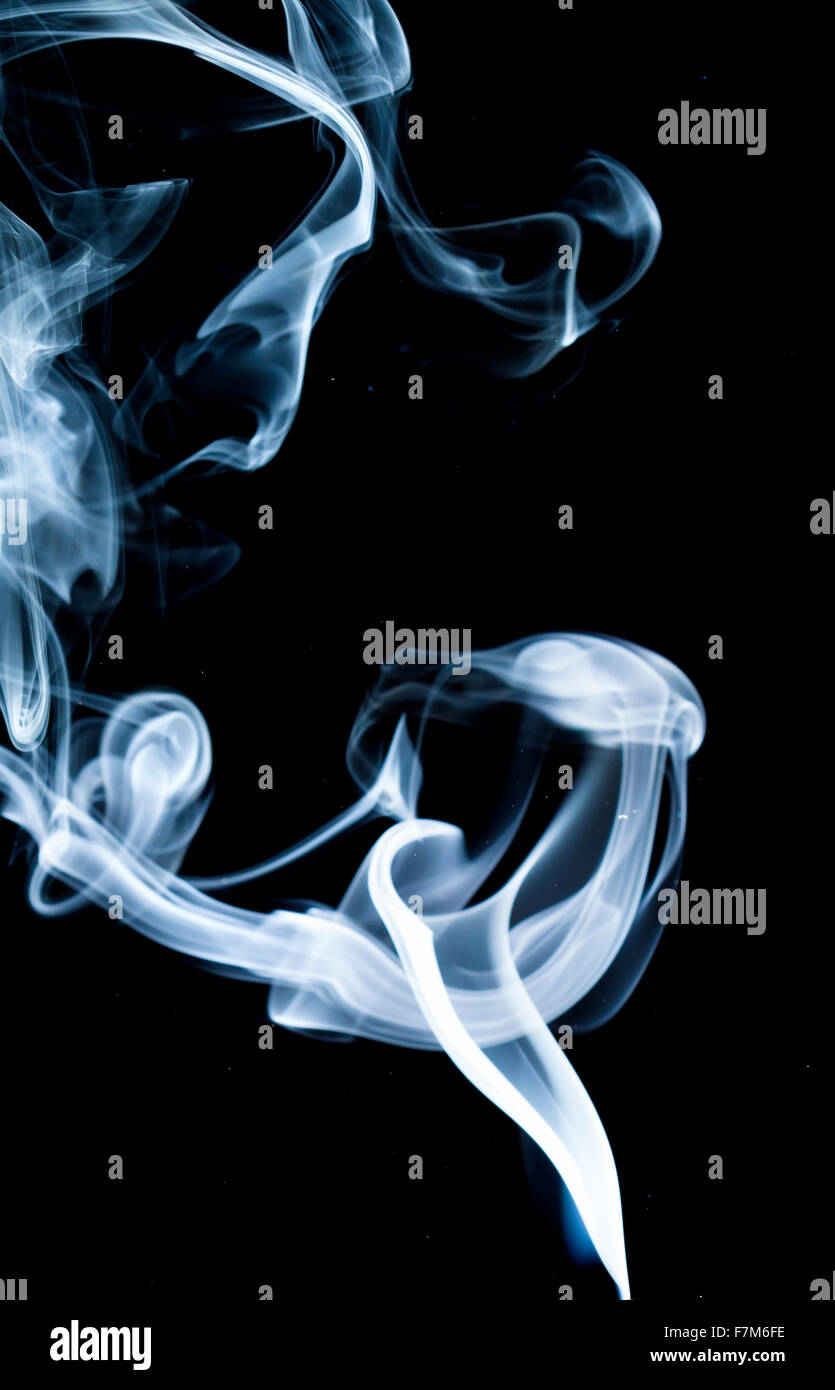 Wisp of smoke on black background Stock Photo - Alamy