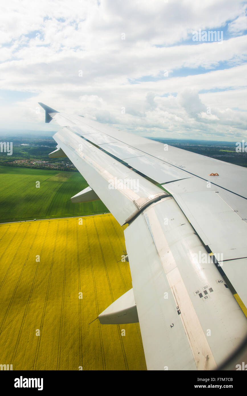 Airplane wing out of window Stock Photo - Alamy