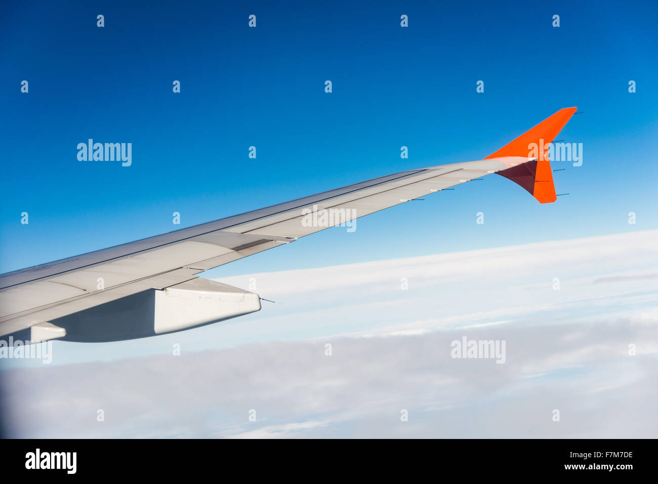 Airplane wing out of window Stock Photo - Alamy