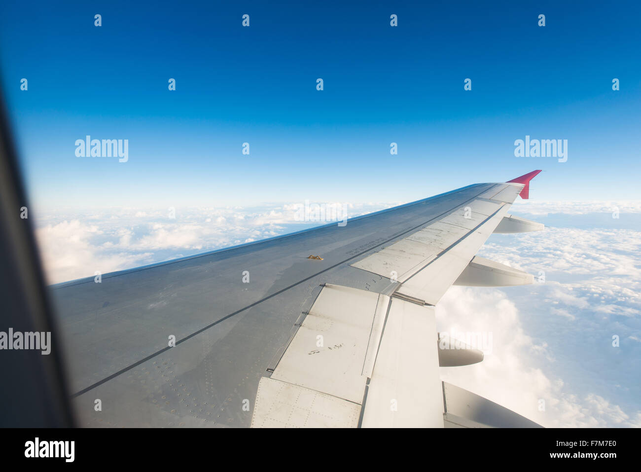 Airplane wing out of window Stock Photo - Alamy