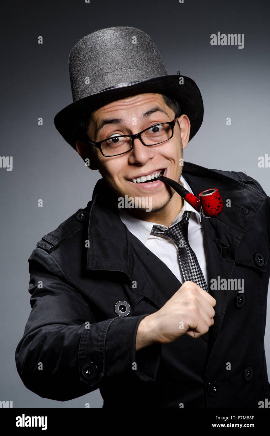 Funny detective with pipe and hat Stock Photo - Alamy