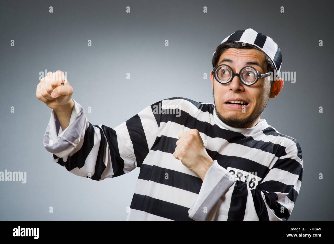 Funny prison inmate in concept Stock Photo - Alamy