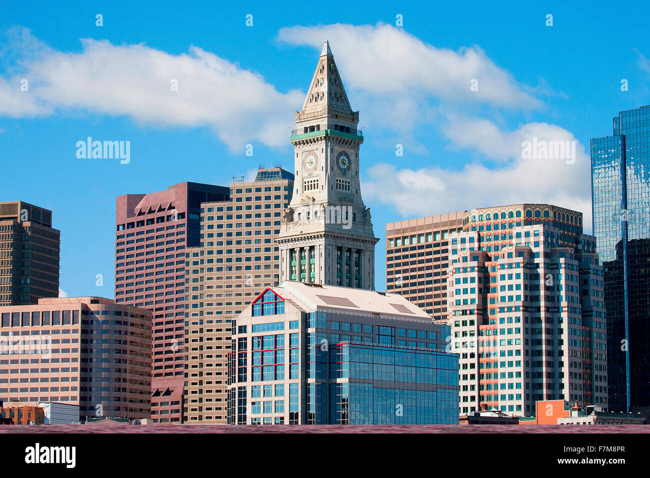 Commerce House Tower (built 1910) and Boston Skyline with white puffy ...