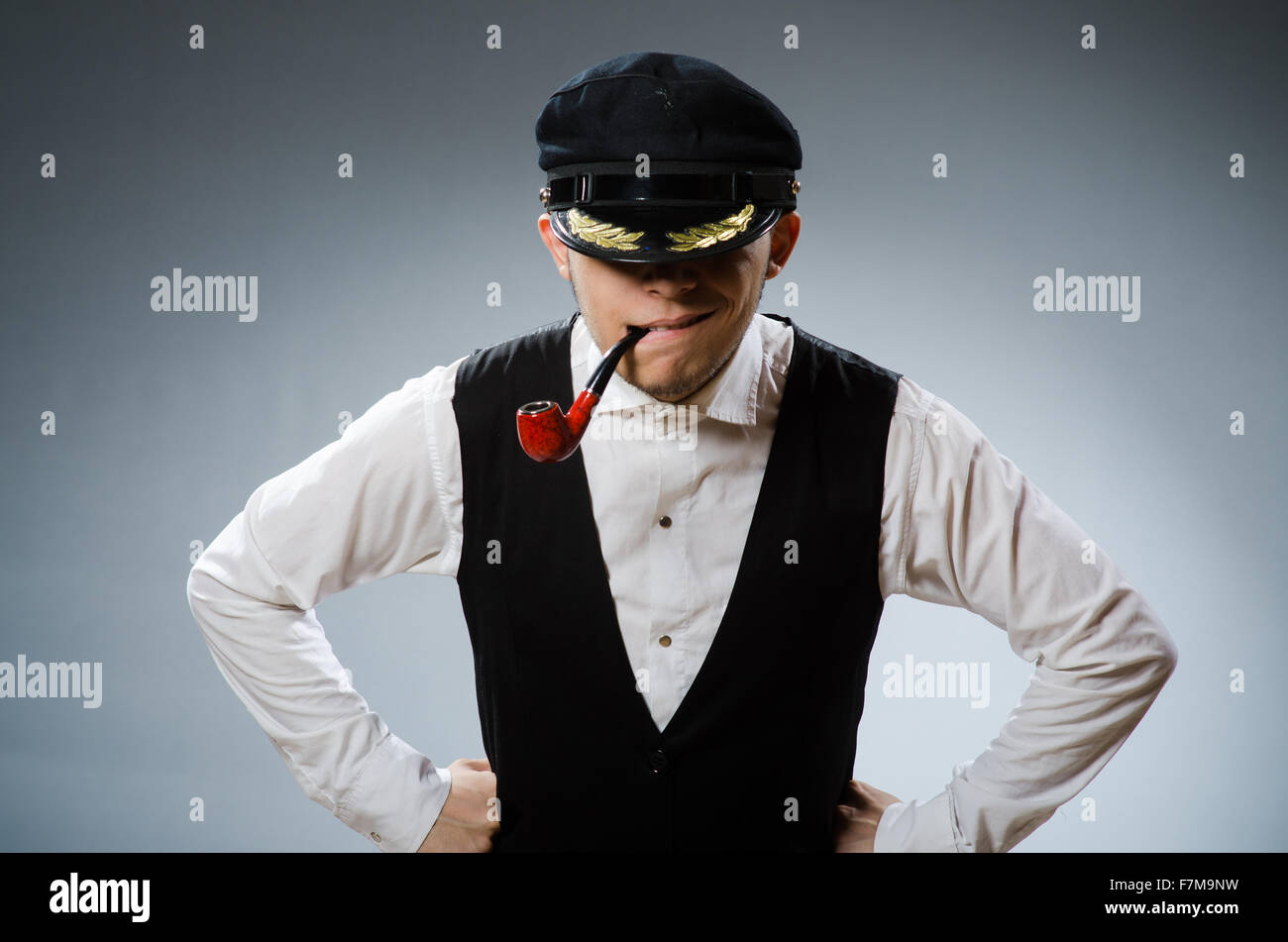 Captain smoking pipe with tobacco Stock Photo - Alamy