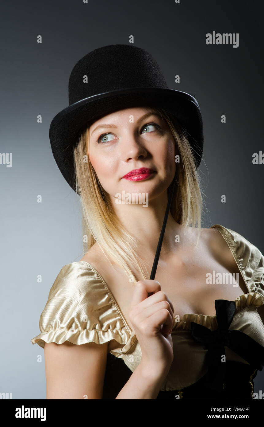 Woman magician with magic wand and hat Stock Photo - Alamy