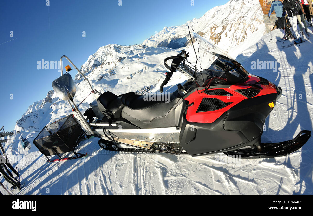 snow mobile sledge parked at mountaint top at beautiful winter sunny ...