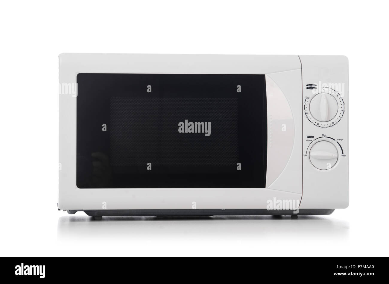 Microwave oven on the table Stock Photo - Alamy