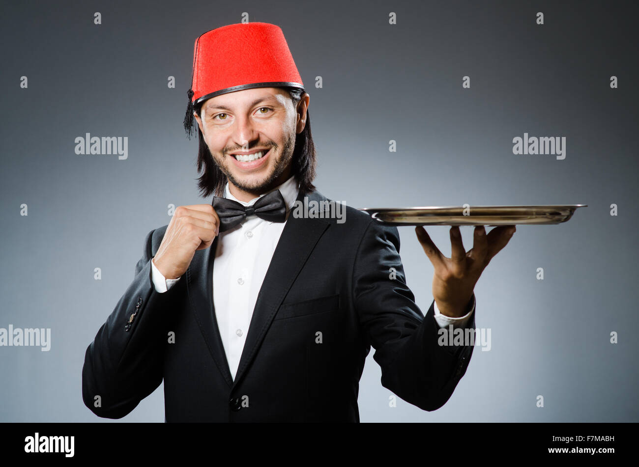 Waiter wearing traditional turkish hat Stock Photo - Alamy