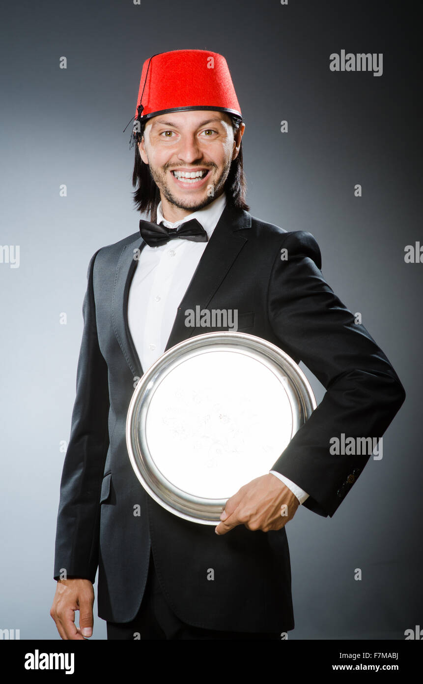 Waiter wearing traditional turkish hat Stock Photo - Alamy