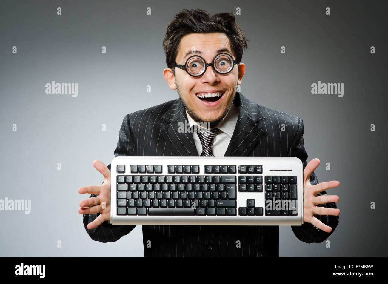 Comouter geek with computer keyboard Stock Photo - Alamy