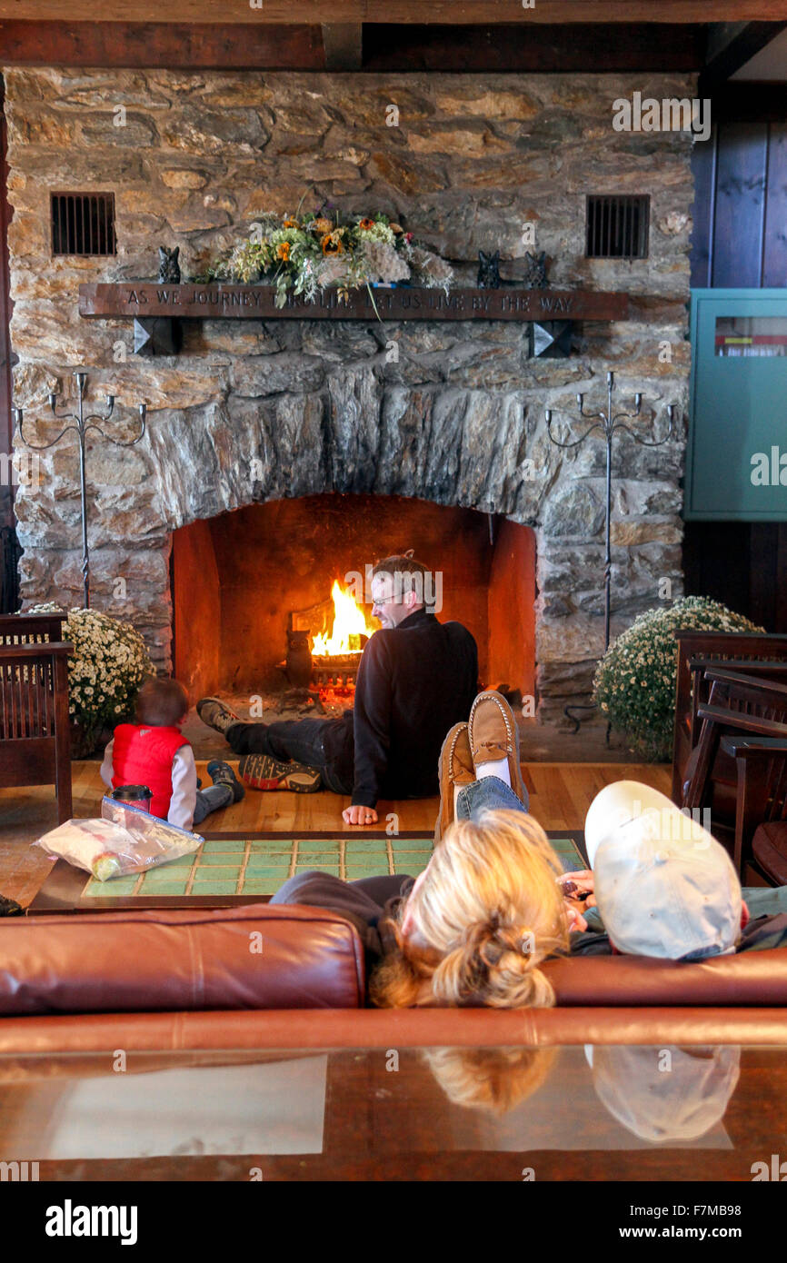 Guests relax in front of the fireplace at Bascom Lodge, Mount Greylock ...