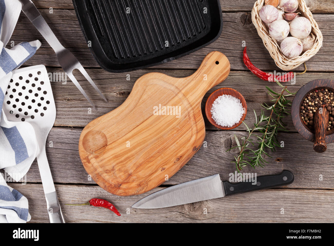 Cooking utensils and spices on wooden table. Top view Stock Photo - Alamy