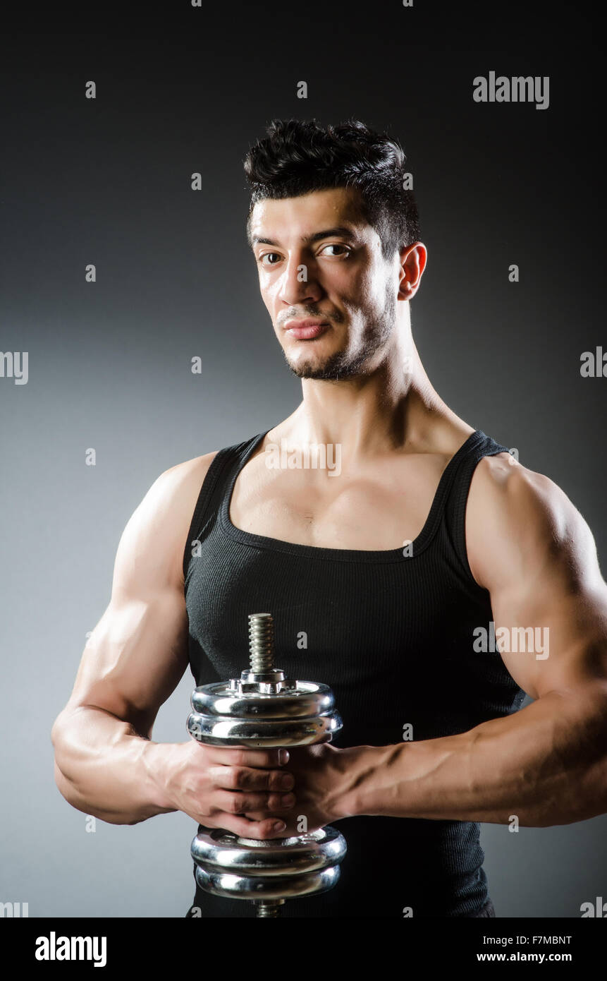 Muscular ripped bodybuilder with dumbbells Stock Photo - Alamy