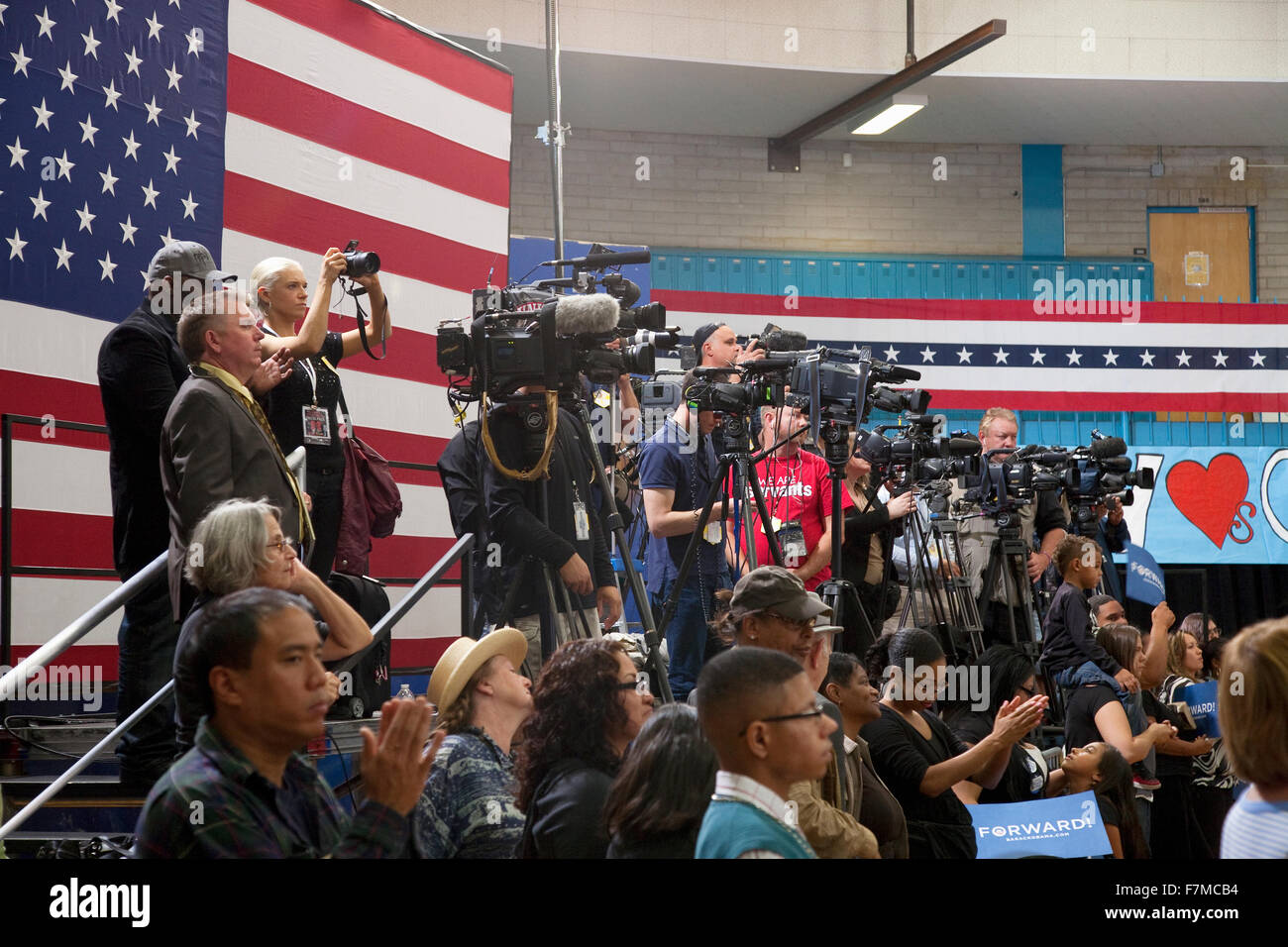 National Press and TV cameramen stand in front of a large US Flag are ...